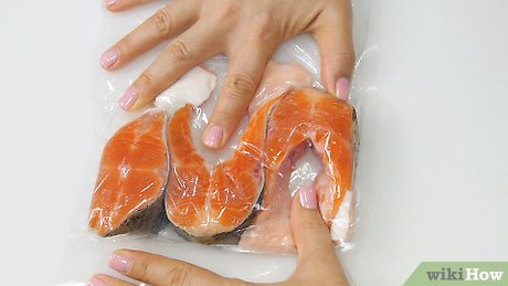 How do you wrap salmon for freezing?