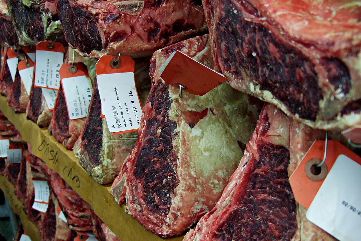 How is beef aged without spoiling?