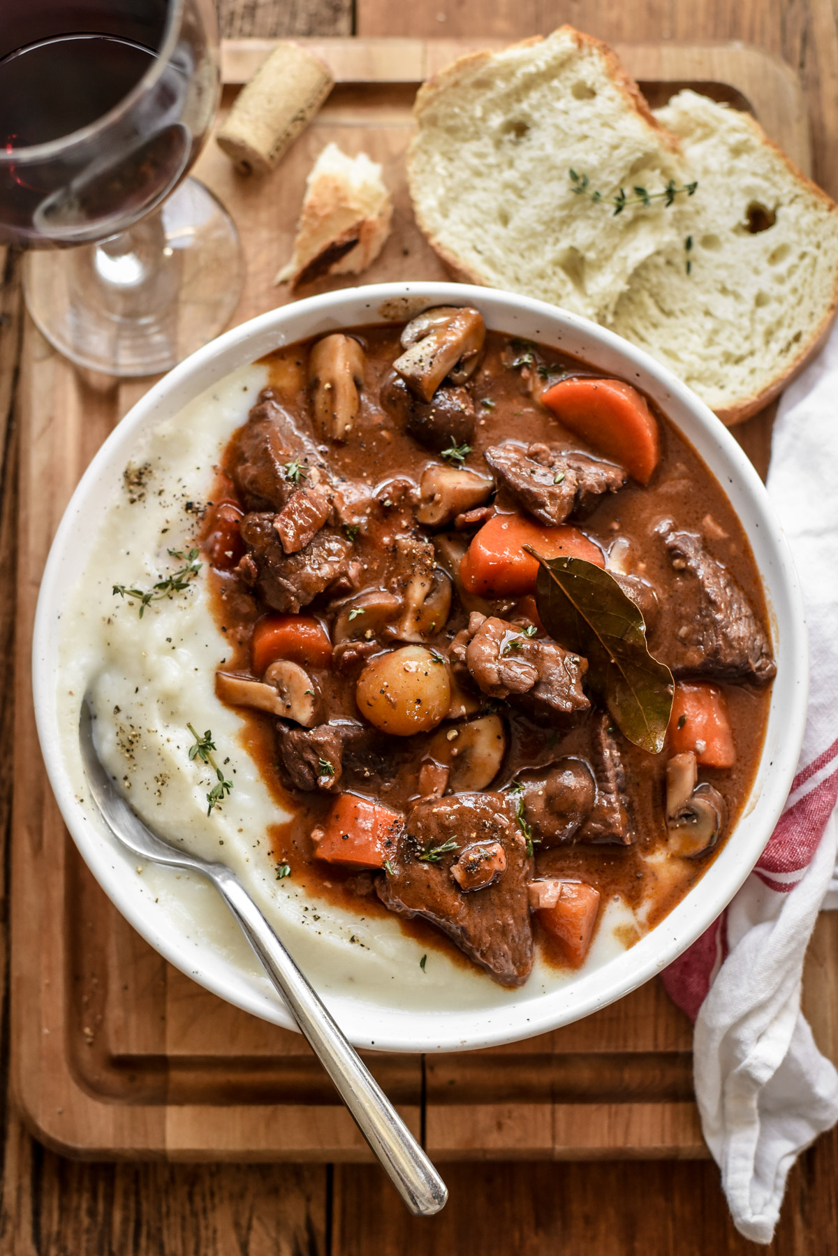 How is beef bourguignon served in France?