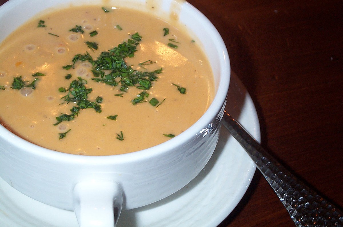 How is bisque traditionally served?