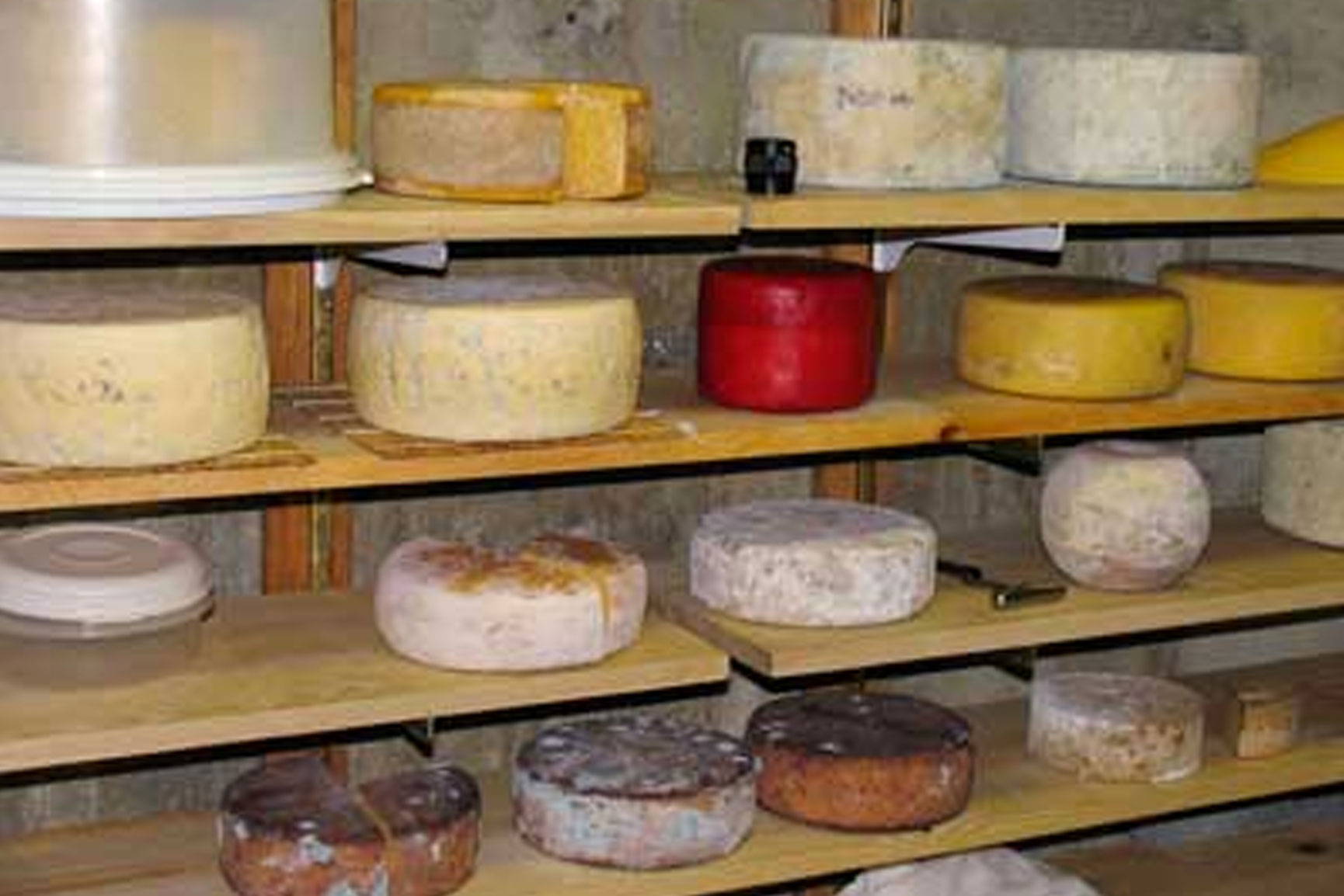 How is cheese aged?