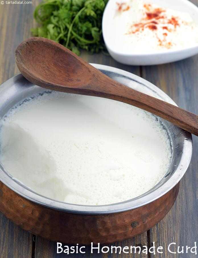 How is curd made from cow's milk?