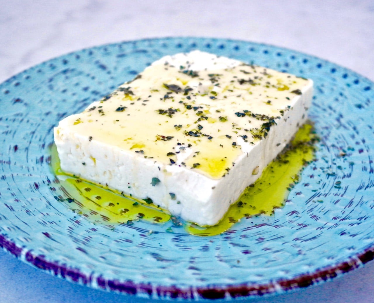 How is feta commonly used in Greek cuisine?