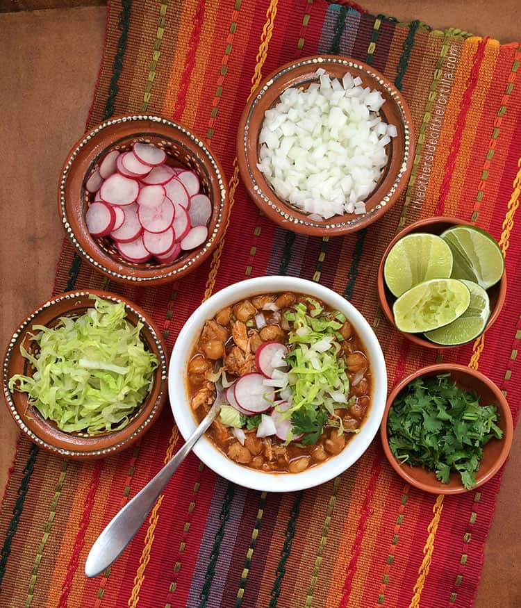 How is pozole traditionally served?