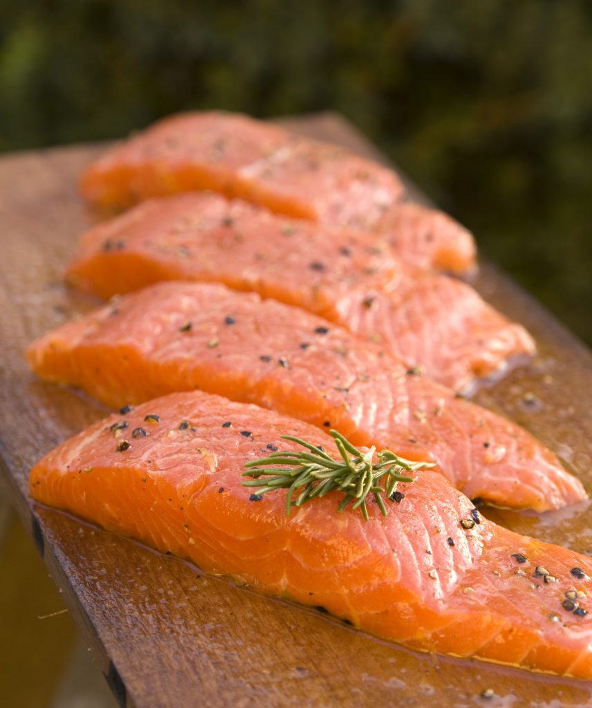 How is smoked salmon processed?