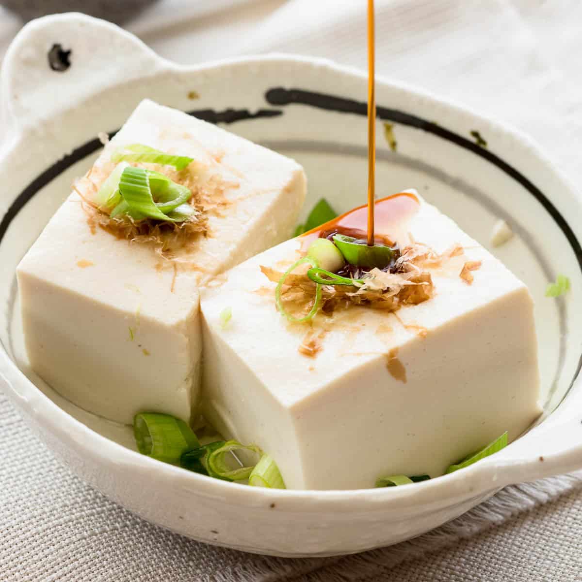 How is tofu prepared in Japan?