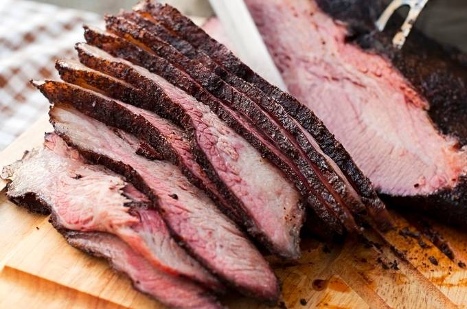 How long can a brisket sit out before cooking?