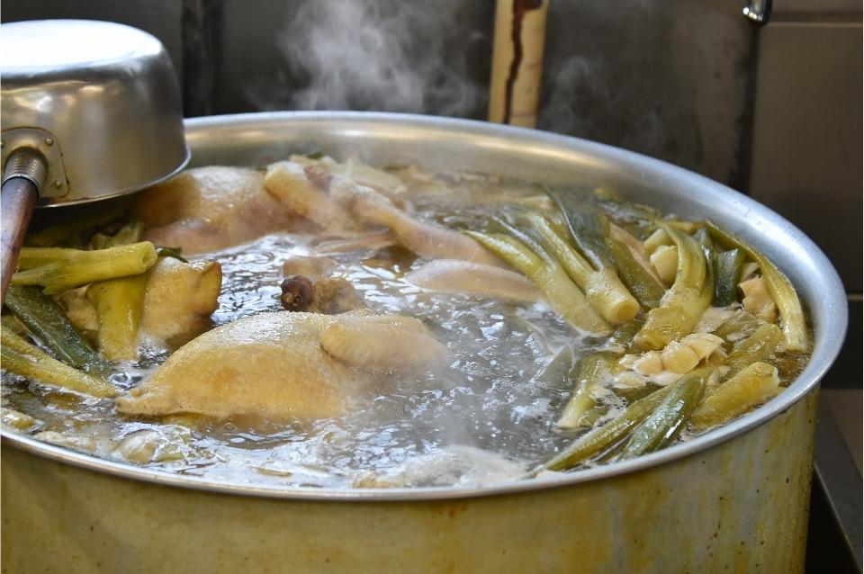 How long can chicken soup simmer?