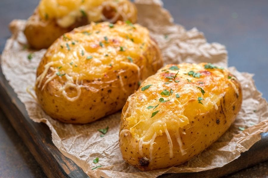 How long can I keep baked potatoes warm in the oven?