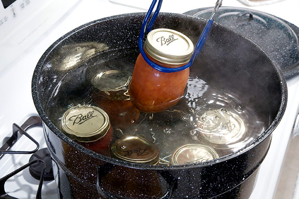 How long do you boil canning jars to seal them?