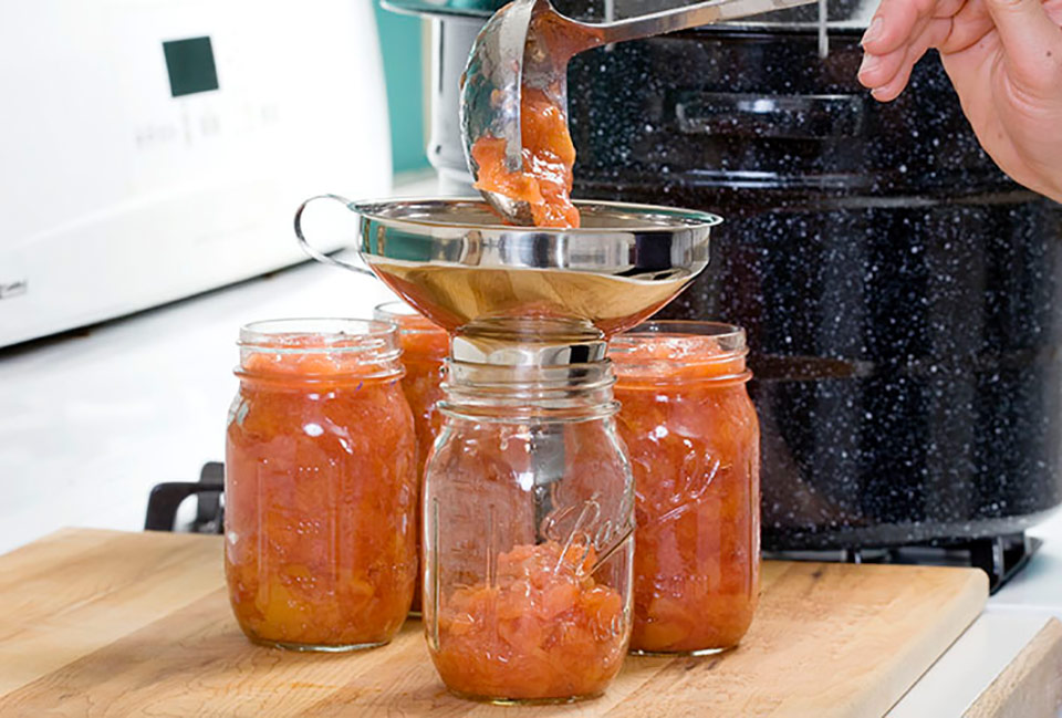 How long do you boil filled jars for canning?