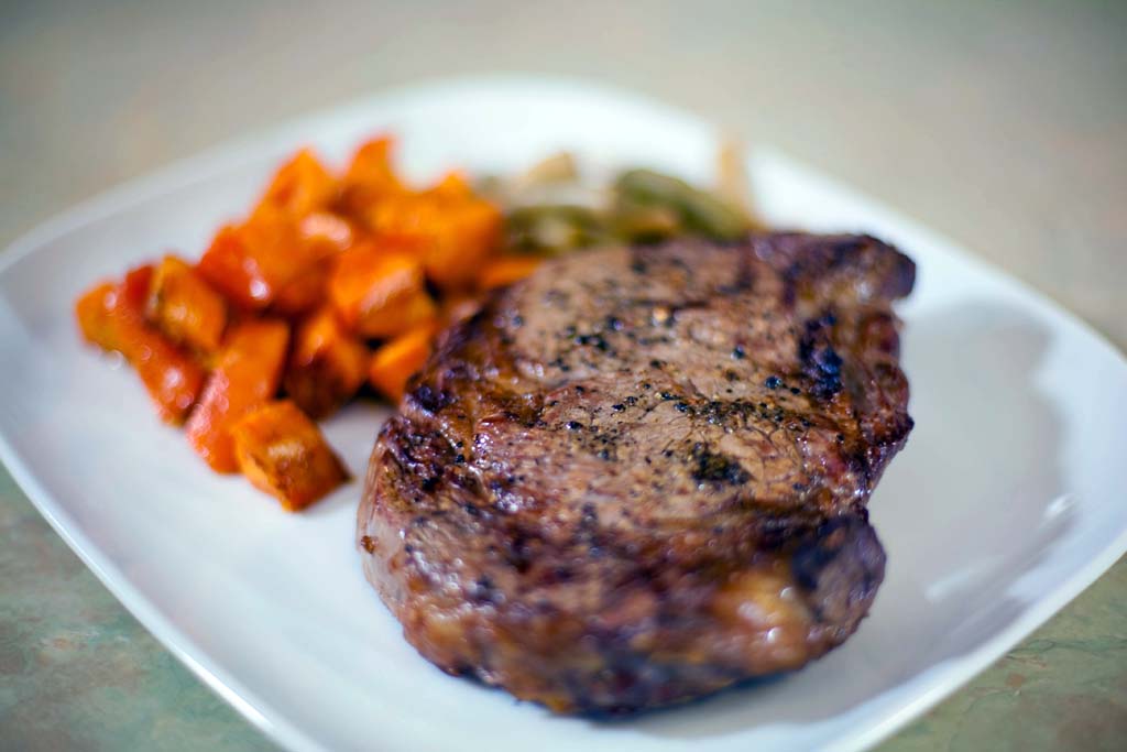 How long do you broil a ribeye steak on each side?