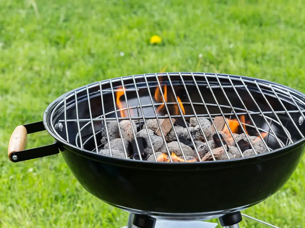 How long do you burn charcoal before cooking?