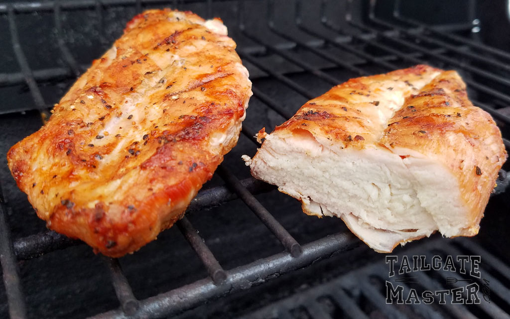 How long do you cook chicken on one side on the grill?