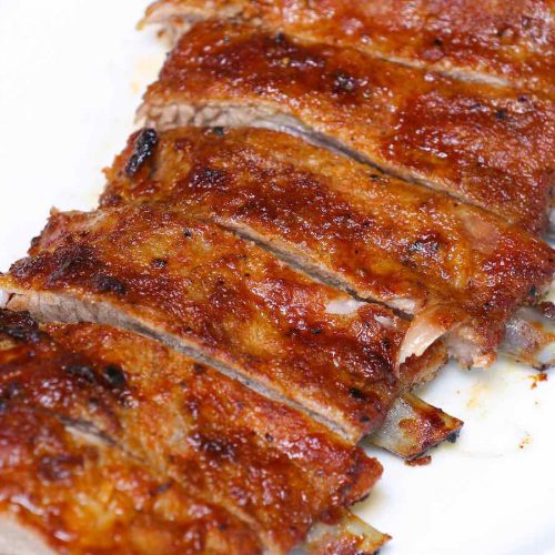 How long do you leave ribs in the oven at 450?