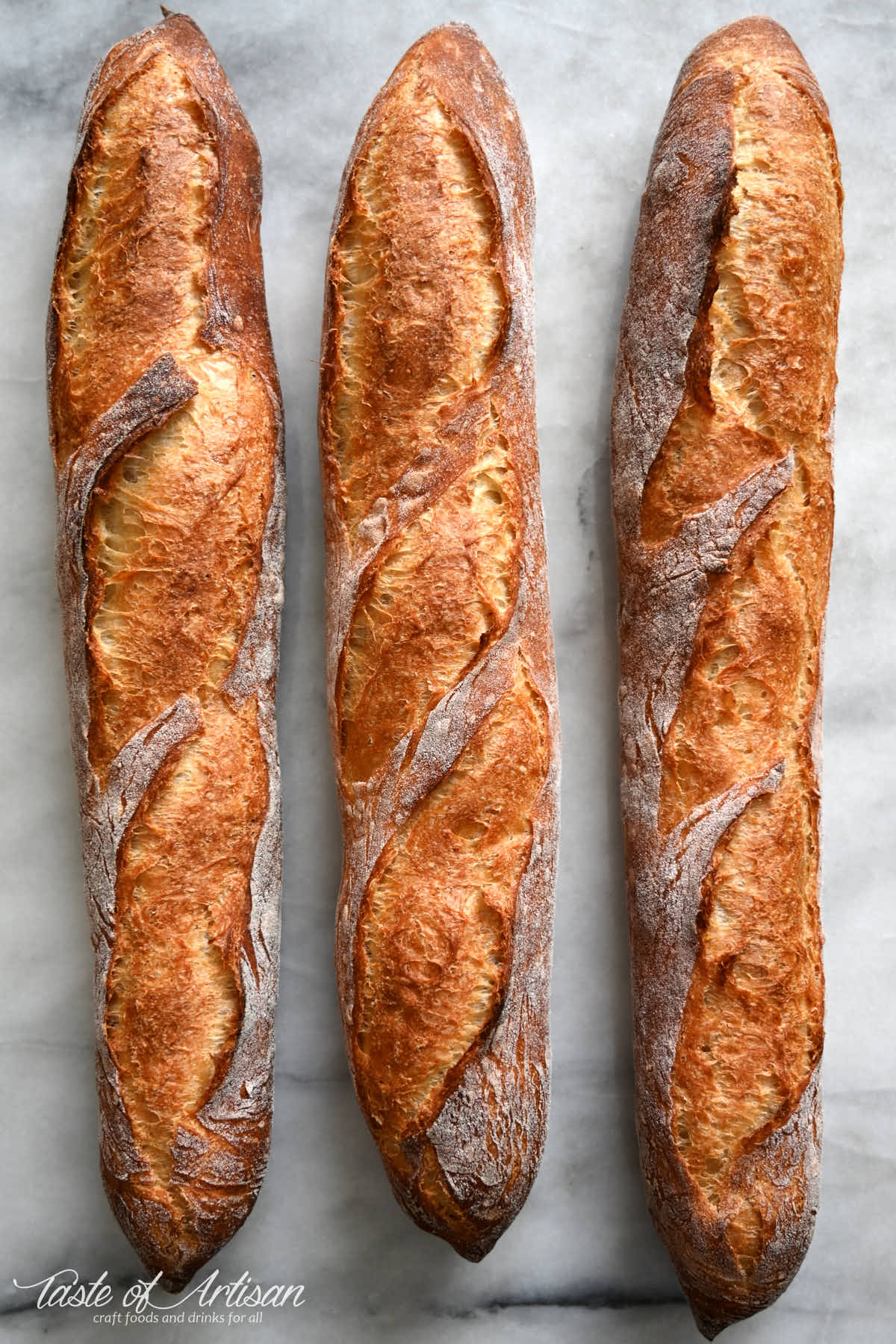 How long do you spray a baguette with water before baking?