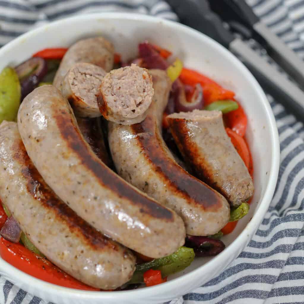 How long does it take to cook Italian sausage on top of the stove?