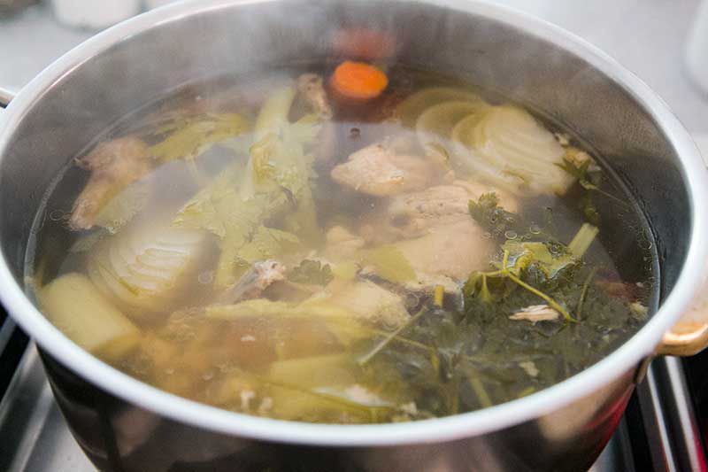 How long should a chicken stock be simmered?