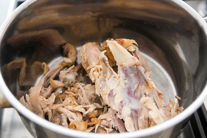 How long should chicken bones be simmered?