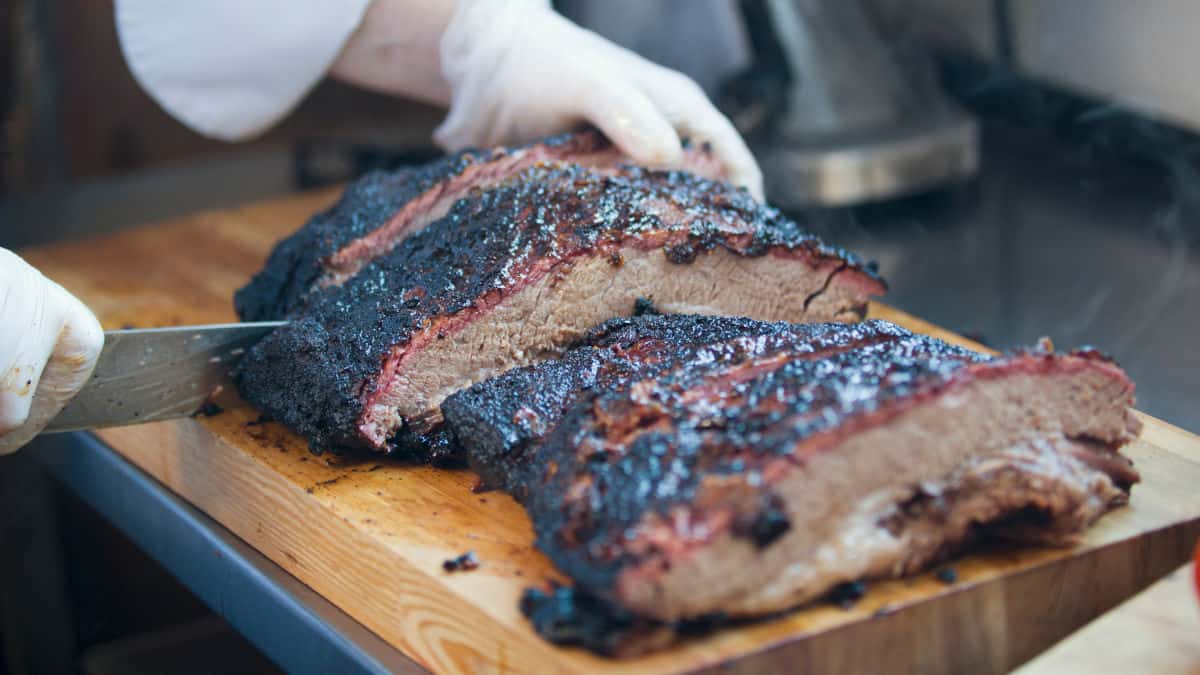 How long should you leave a brisket out before cooking?