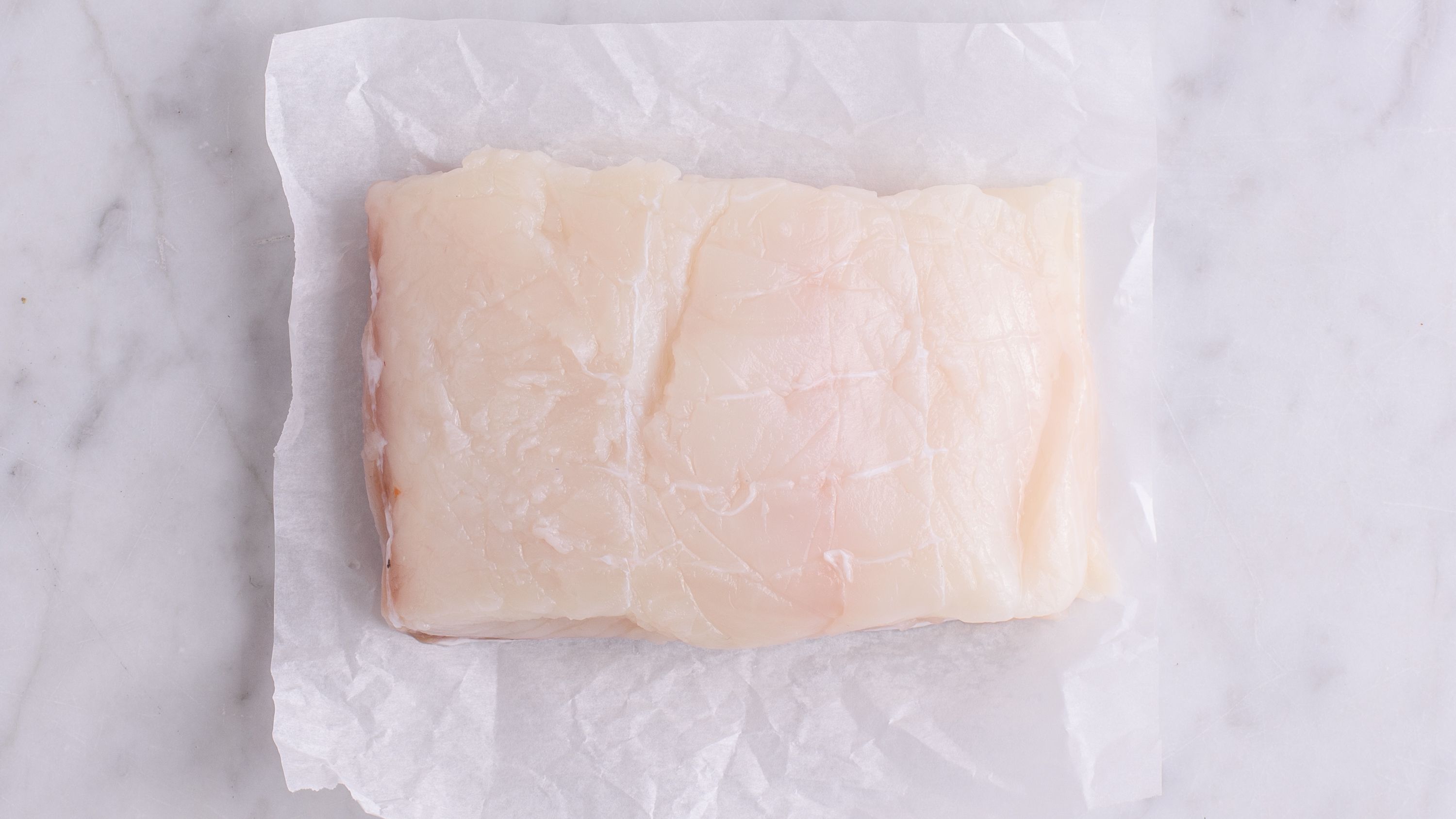 How many calories are in a half pound of halibut?