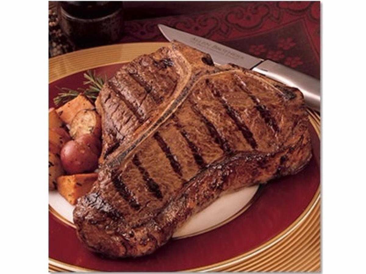 How many calories are in a porterhouse steak cooked?