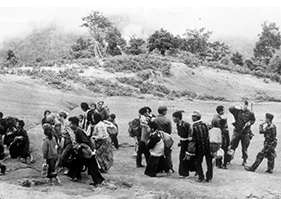 How many Hmong civilians were killed escaping Laos?