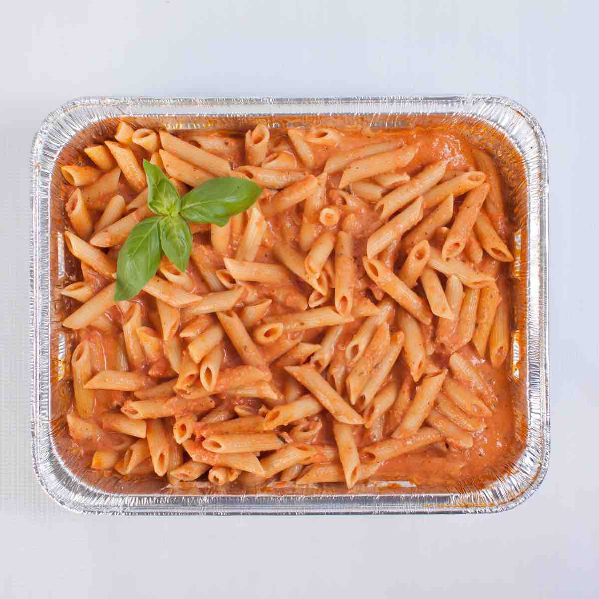 How much does a half tray of penne alla vodka feed?