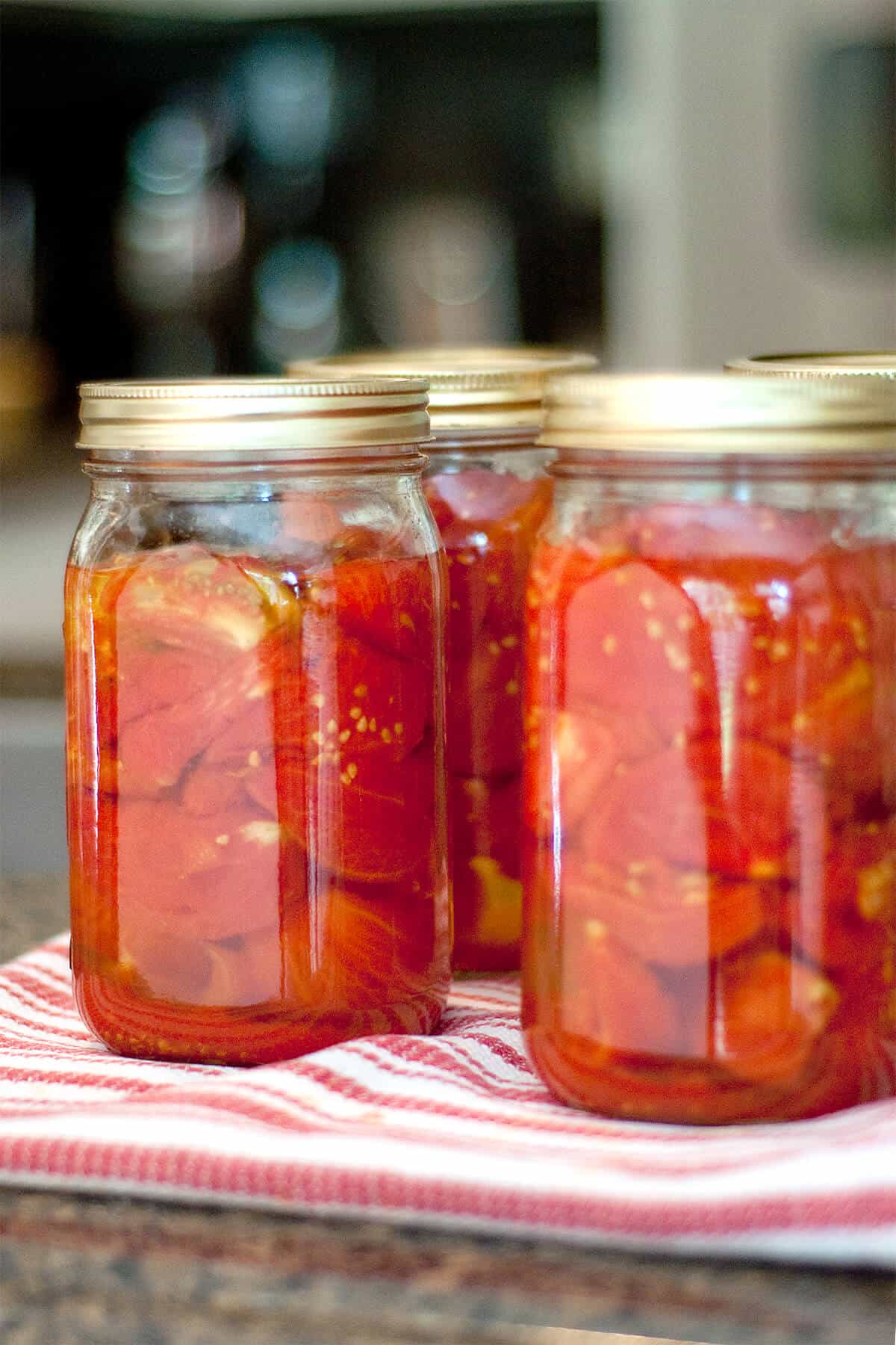 How much lemon juice and salt do you add to tomatoes when canning?