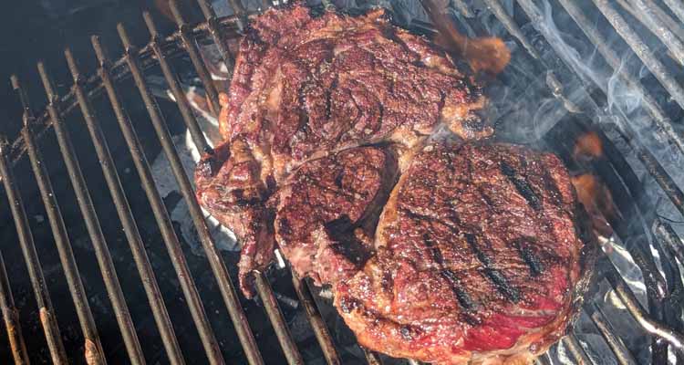 How often do you flip a steak on a charcoal grill?