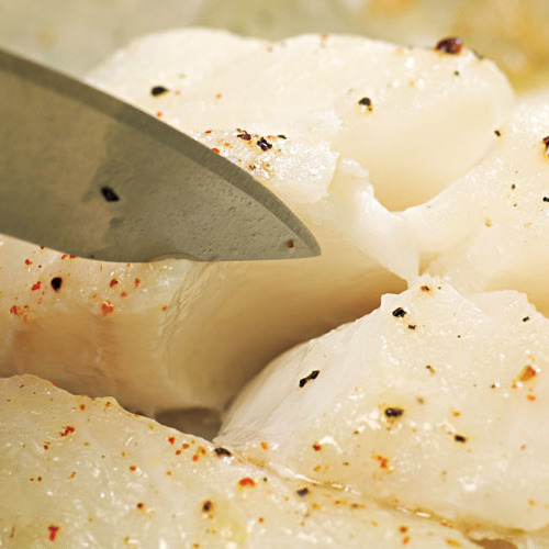 How should cod look when cooked?
