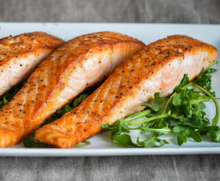 How should salmon be cooked in a restaurant?