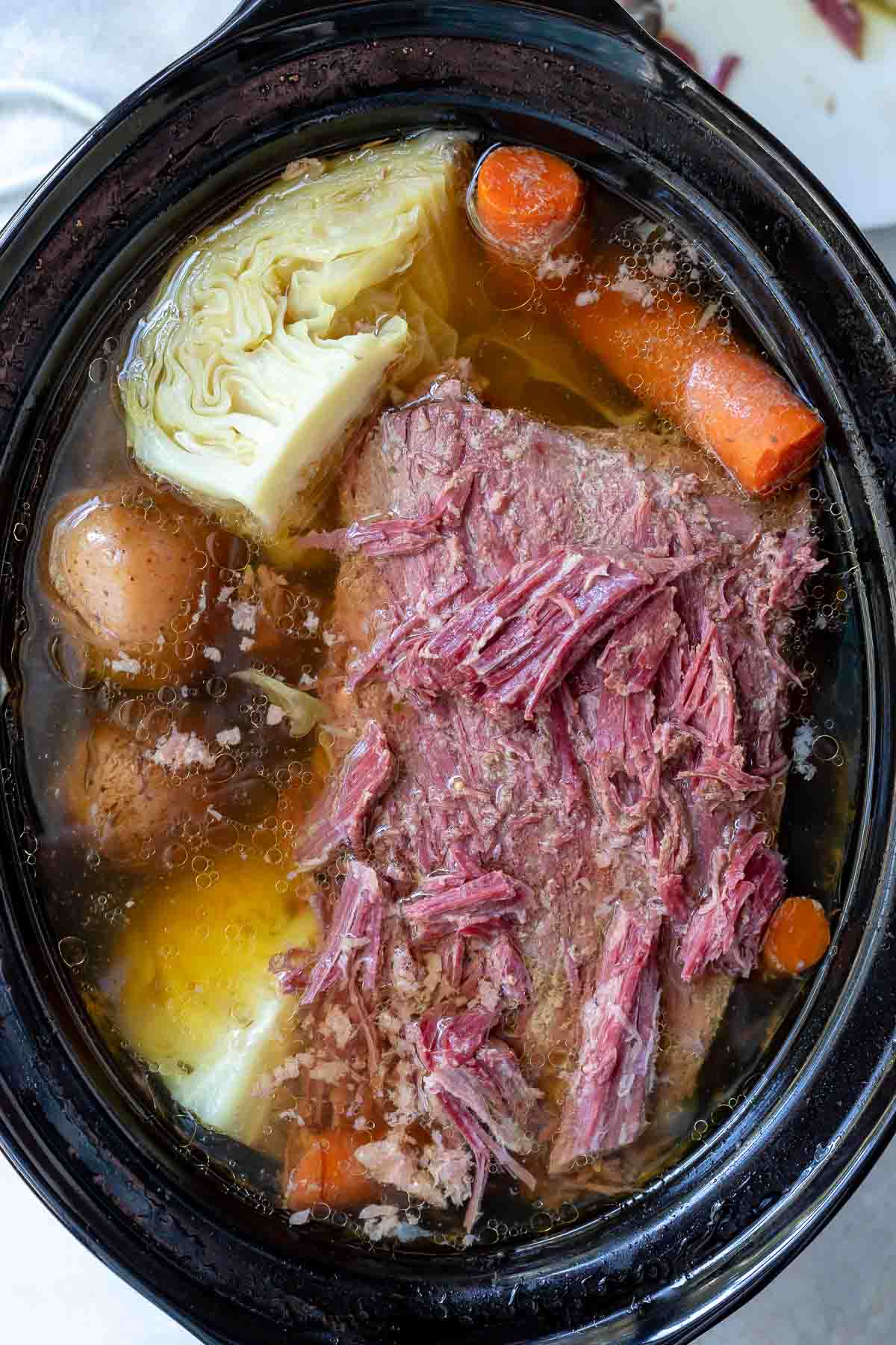 How to cook a brisket in a crock pot with cabbage?