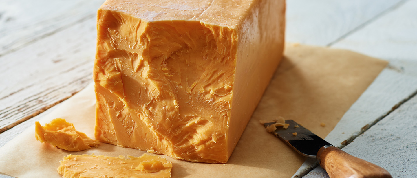 Is all cheddar cheese aged?