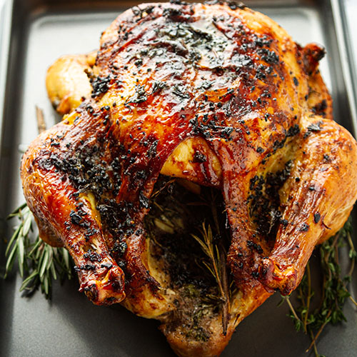 Is it better to bake a whole chicken at 350 or 400?