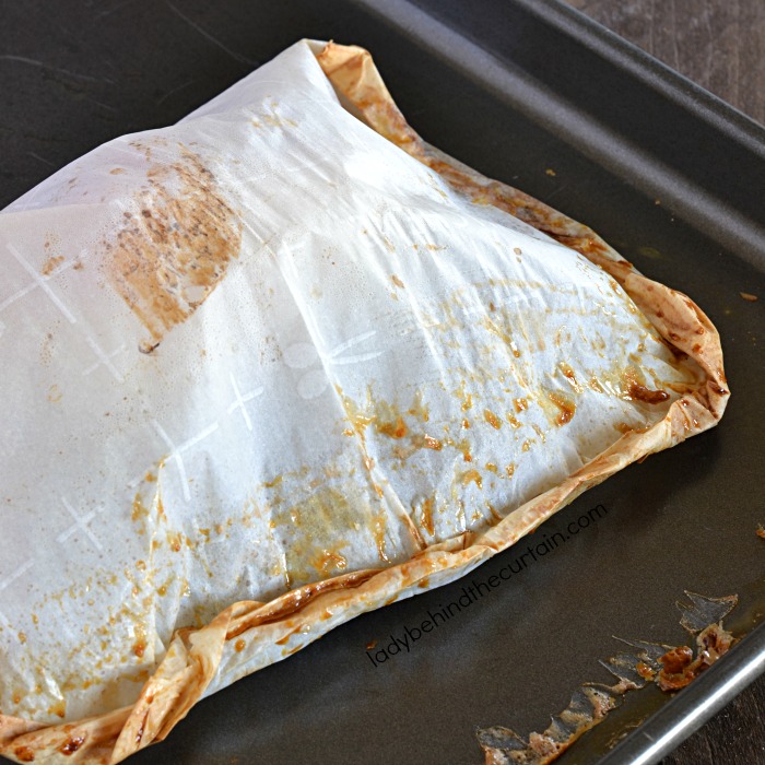 Is it better to bake chicken on parchment paper or foil?