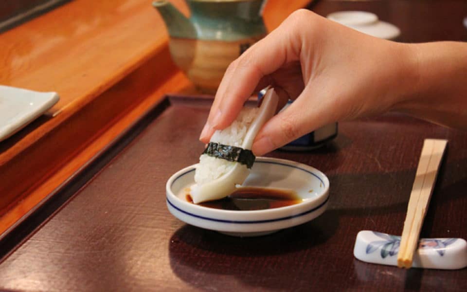 Is it disrespectful to eat sushi with soy sauce?