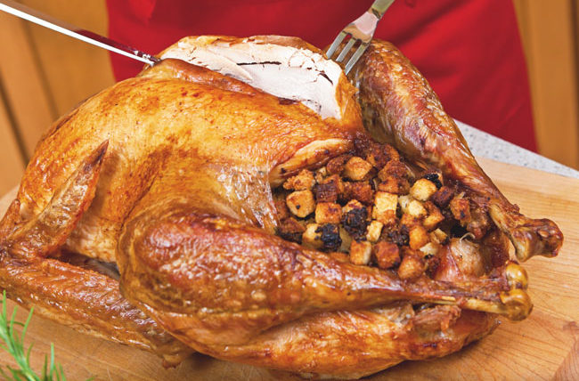 Is it safe to cook stuffing inside turkey?