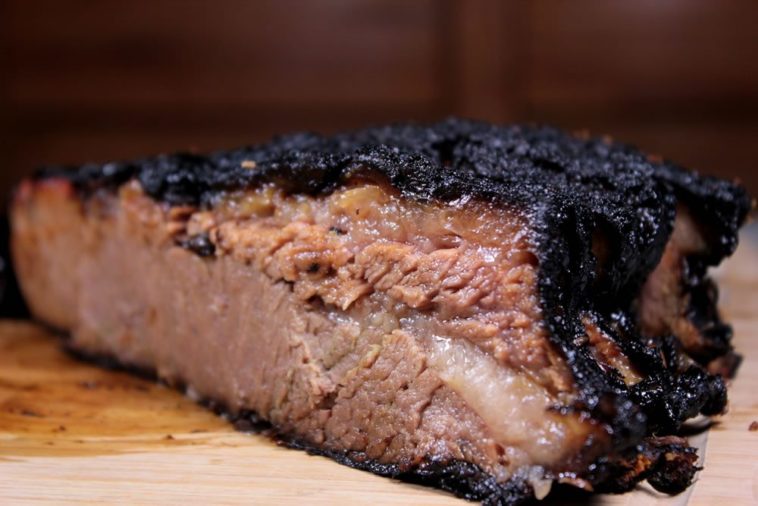 Should brisket be covered while smoking?