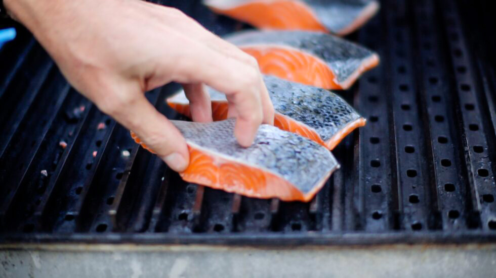 Should I grill my salmon skin side down?