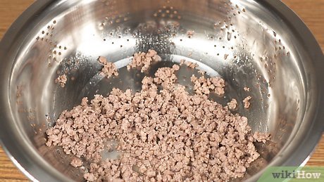 Should I season ground beef before or after draining?