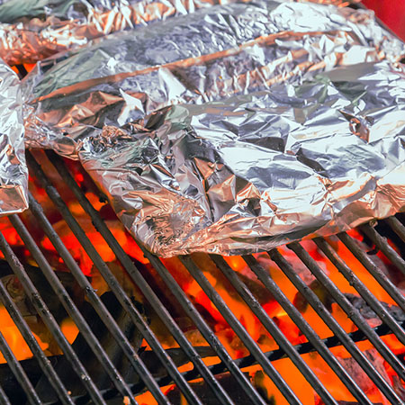 Should I use foil when grilling fish?