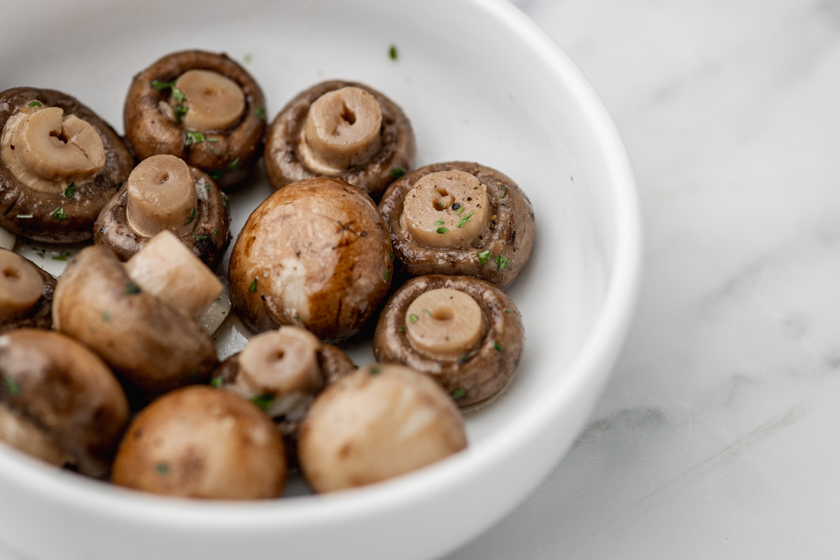 Should mushrooms be boiled before cooking?