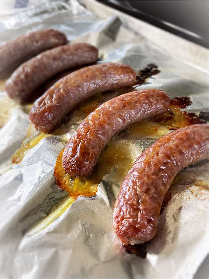 Should sausages be covered in the oven?