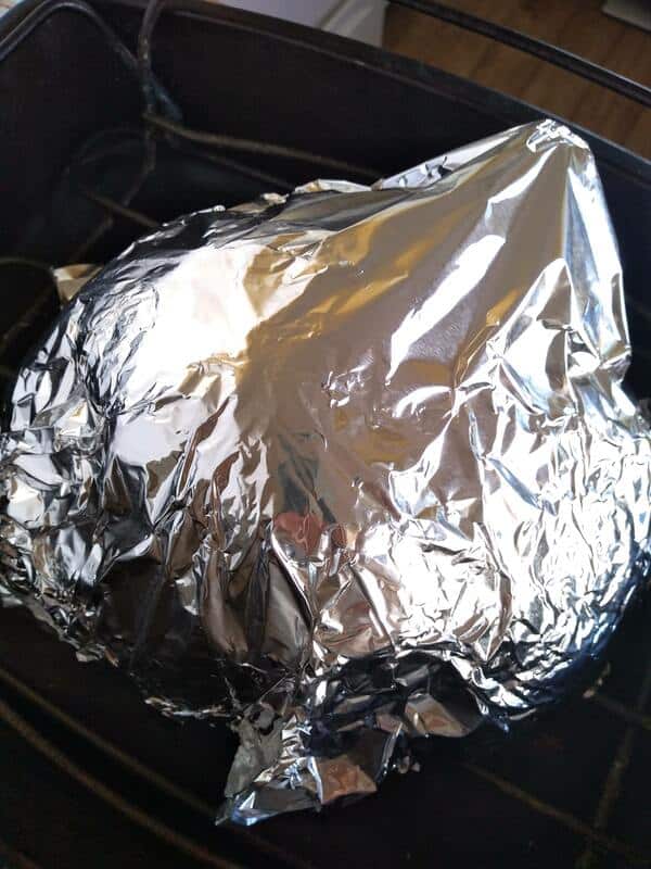 Should you cover ham with foil while cooking?