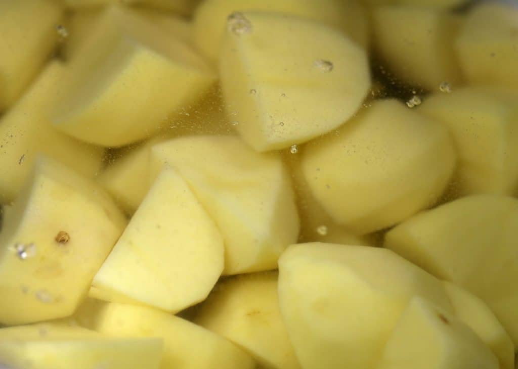 Should you soak potatoes in salt water before baking?