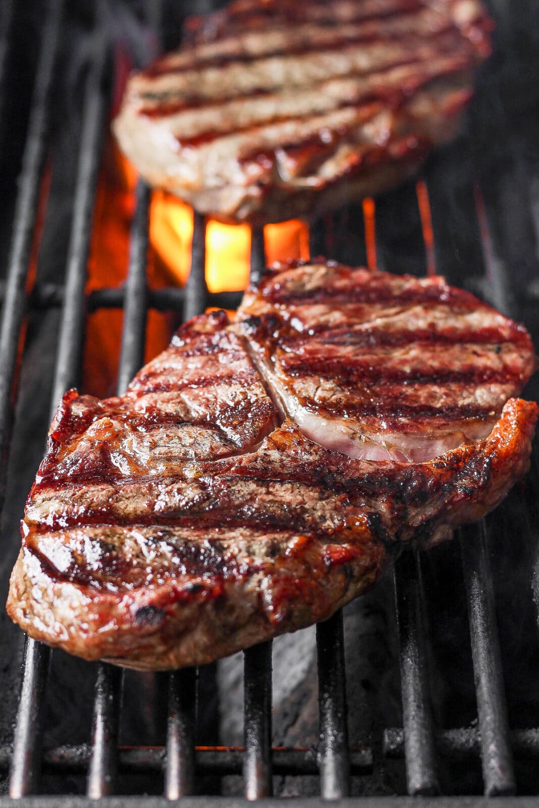 Should you spray the grill before cooking a steak?