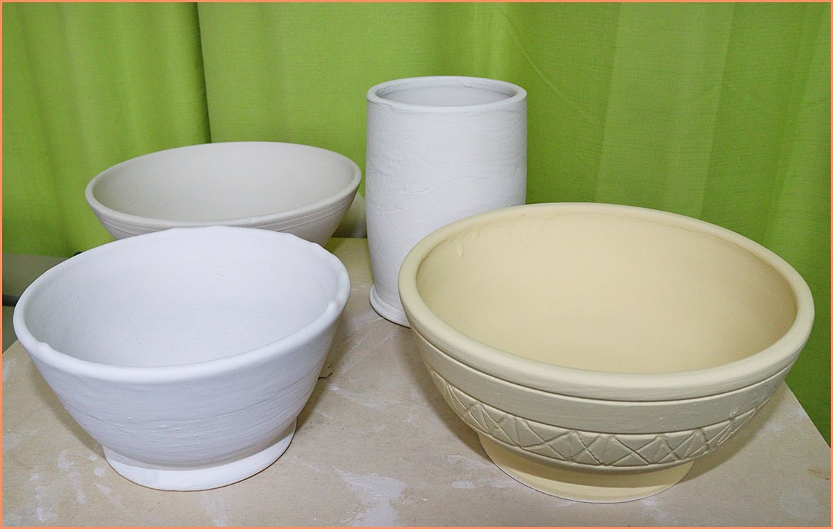 What are the two key differences between glaze ware and bisque ware?