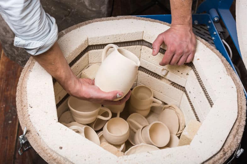 What are the two types of firing in ceramics?