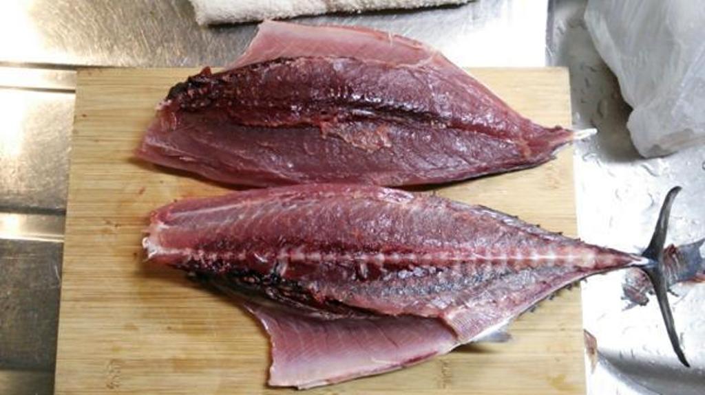 What causes dark meat in fish?
